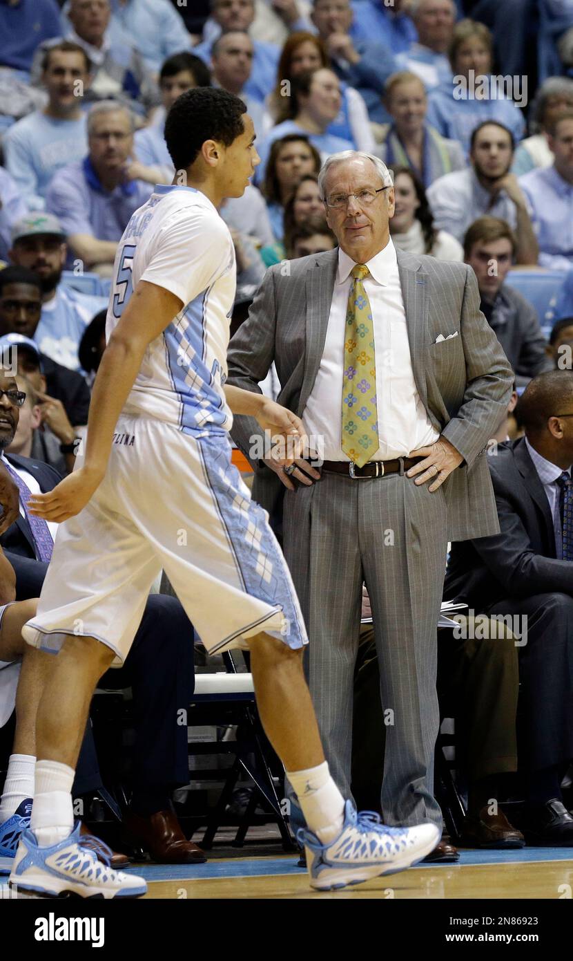 North Carolina coach Roy Williams reacts as Marcus Paige walks past ...
