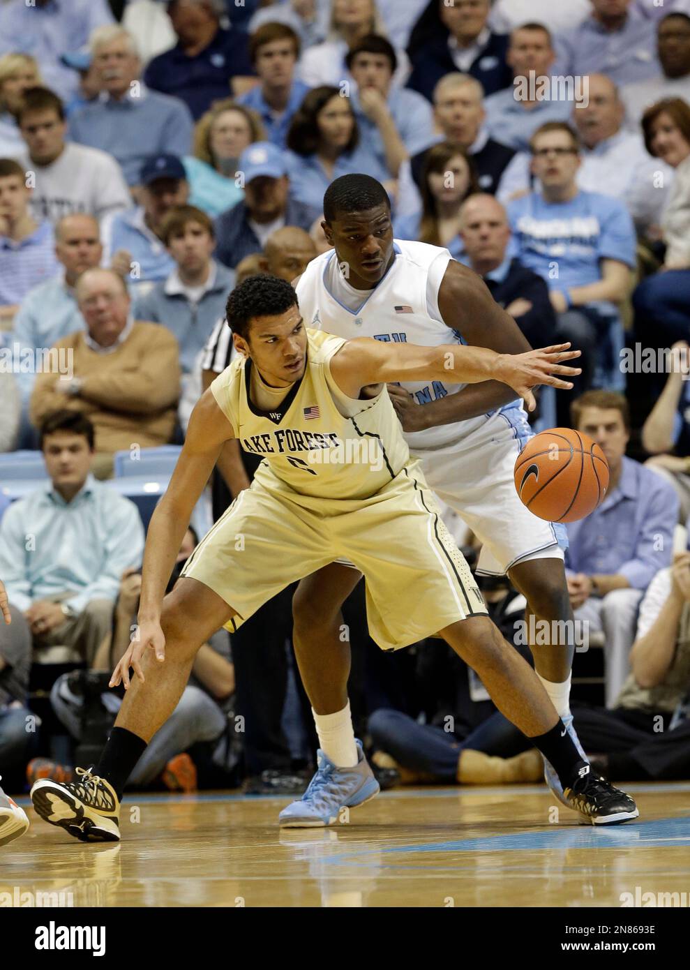 North Carolina's Joel James guards Wake Forest's Devin Thomas during ...