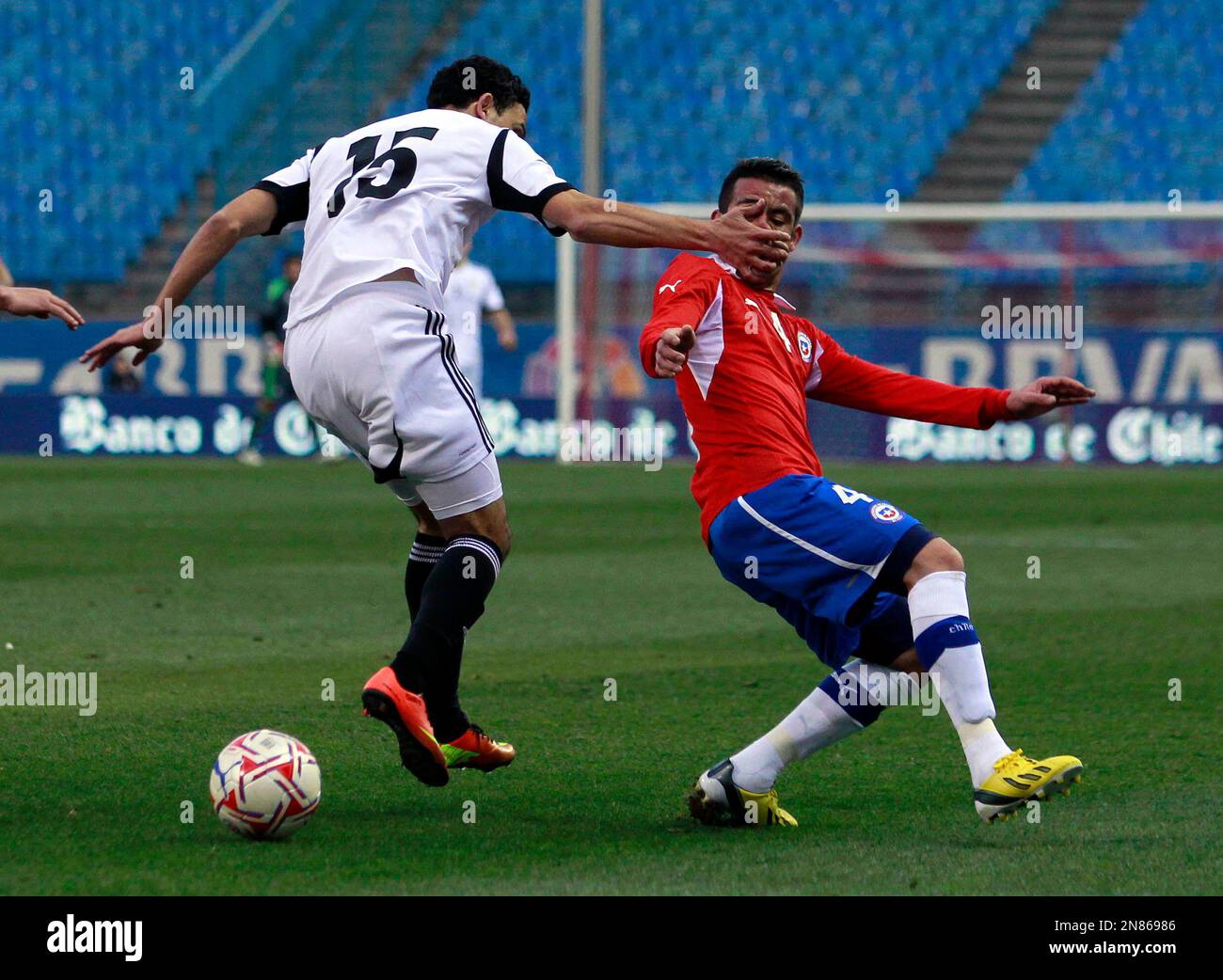 Chile's Mauricio Isla, right, in action with Egypt's Mohamed Nagi, left ...