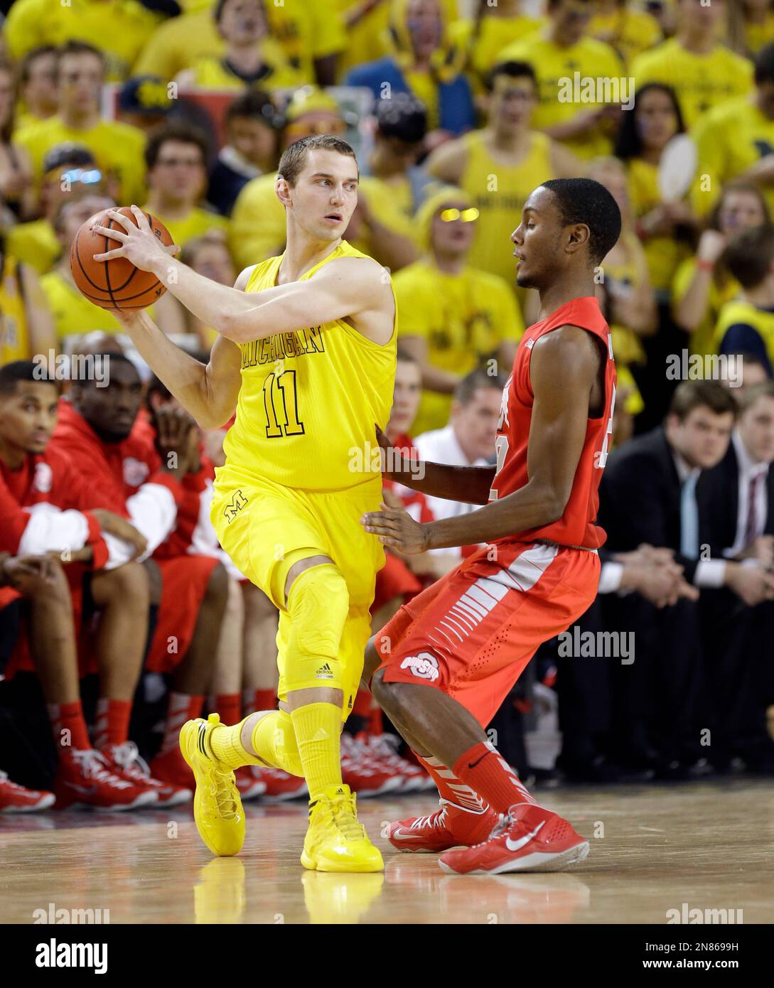 Michigan guard Nik Stauskas (11) looks to pass around Ohio State ...