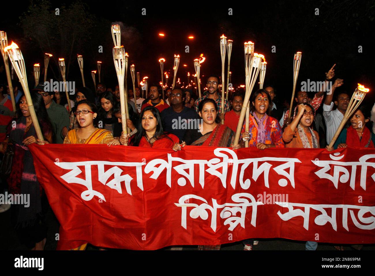 Bangladeshi people take out a torch rally demanding death penalty for ...