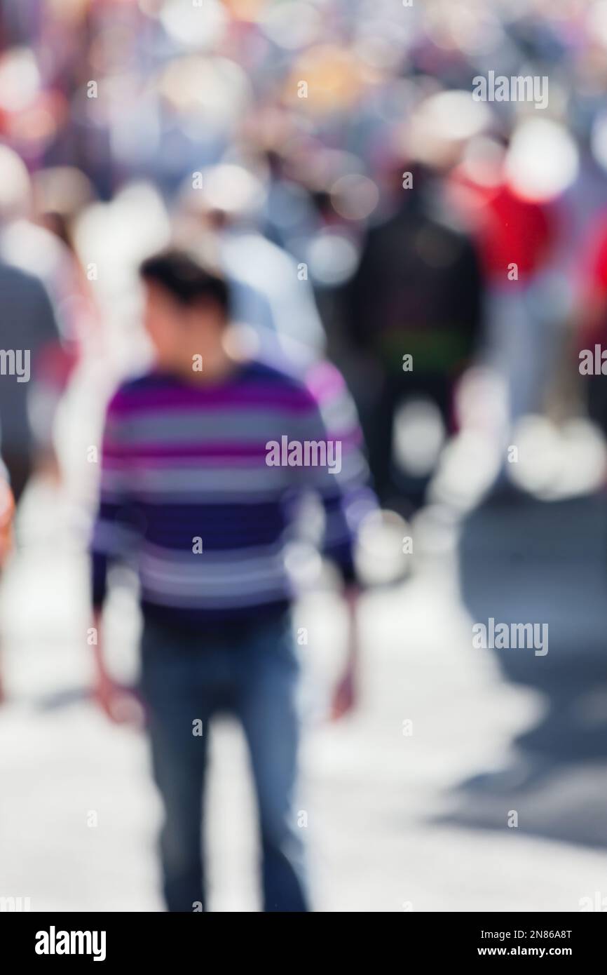 defocused picture of an unrecognizable man in a people crowd Stock ...