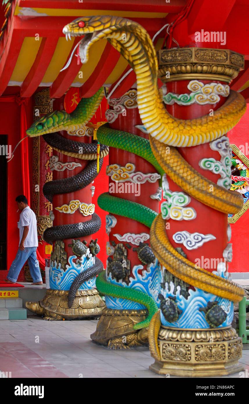Snake sculptures curl around columns of Thean Hock Keong temple, also ...