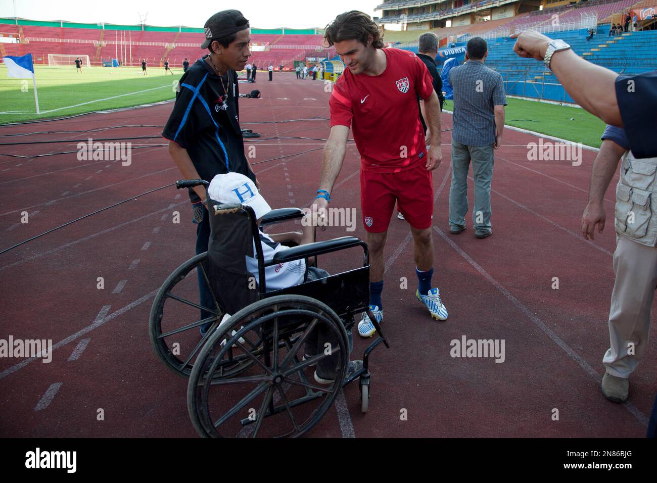 U.S. soccer player Graham Zusi, third from left, shakes hands with a ...