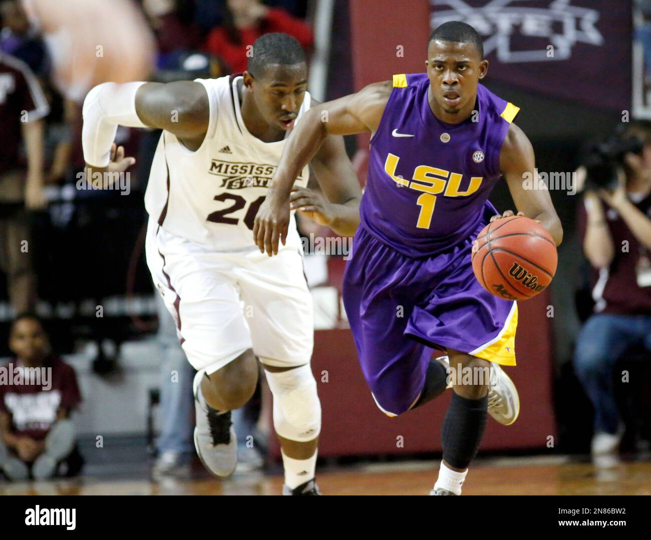 LSU guard Anthony Hickey (1) dribbles past Mississippi State forward ...