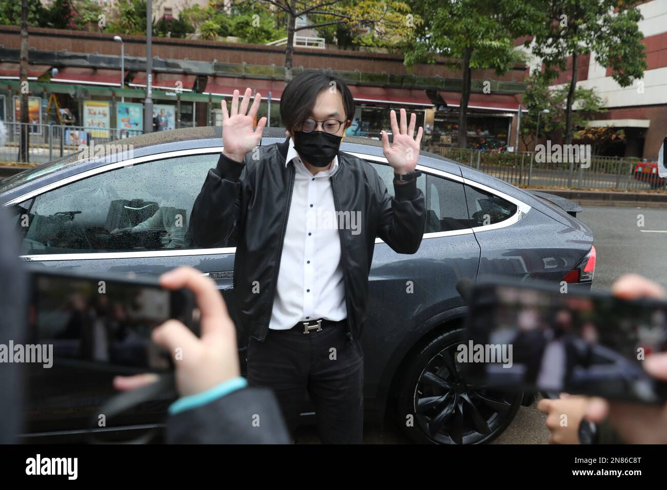 Mike Lam King-nam, founder of AbouThai, leaves after reporting to police at Ma On Shan Police ...