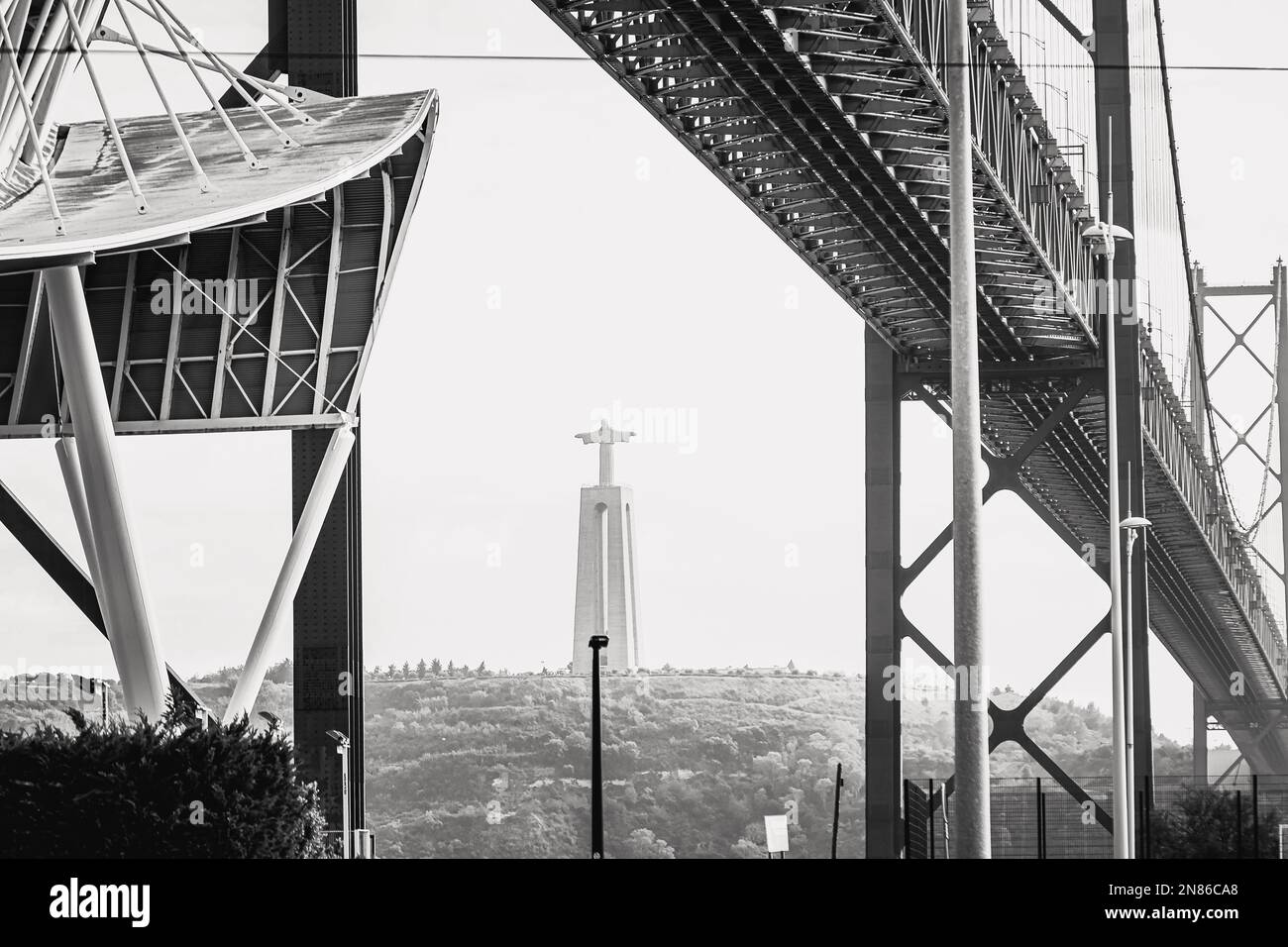 The Statue of Christ at Lisbon framed between the pillars of the 25 de ...