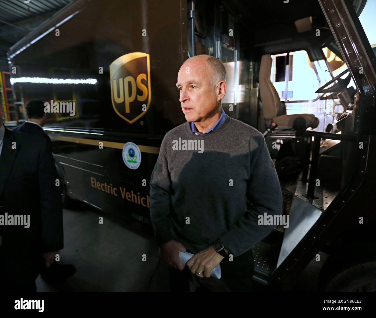 Gov. Jerry Brown talks to reporters after inspecting an electric ...