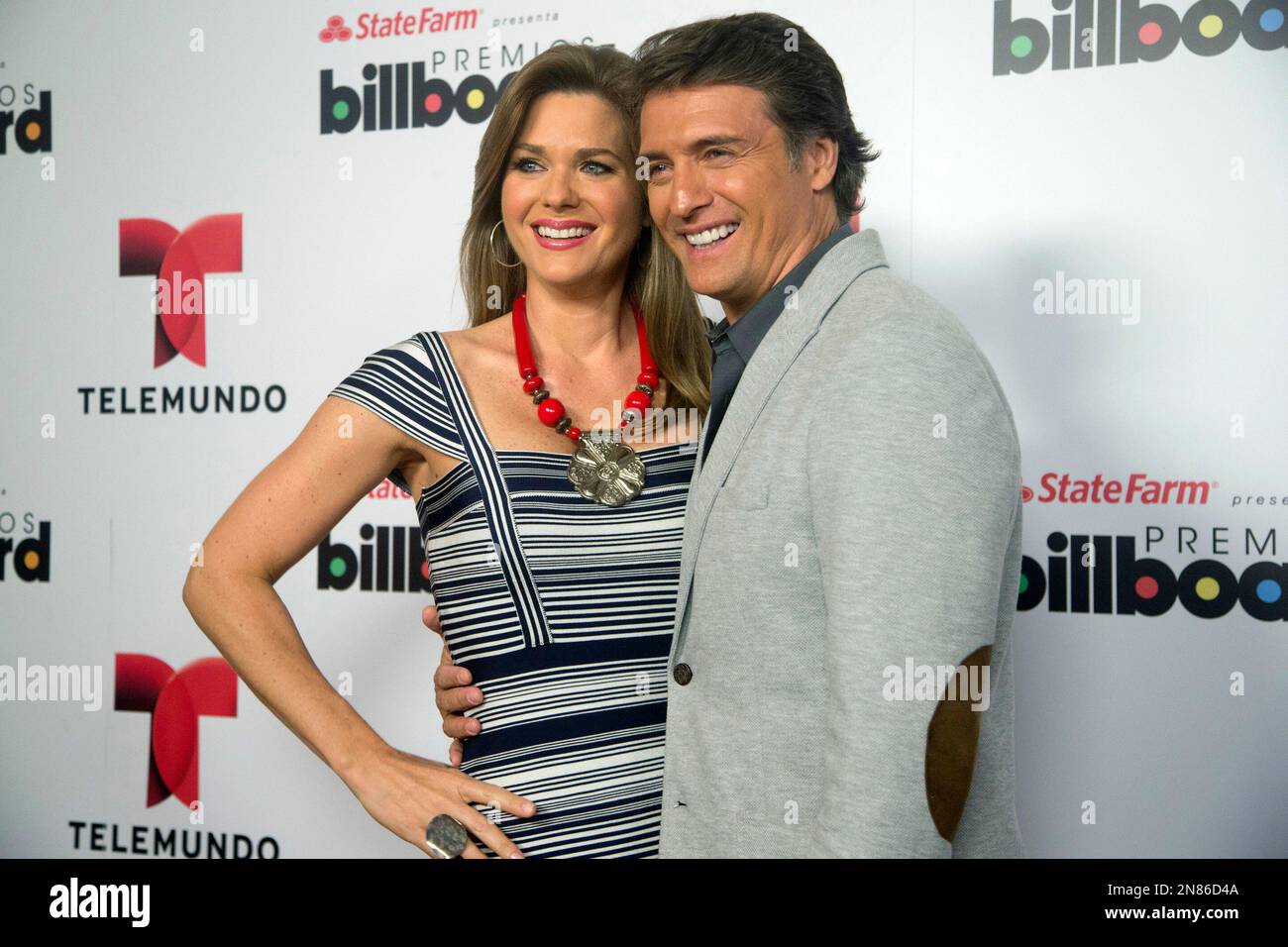 Sonya Smith, left, and Gabriel Coronel pose for photos after announcing ...