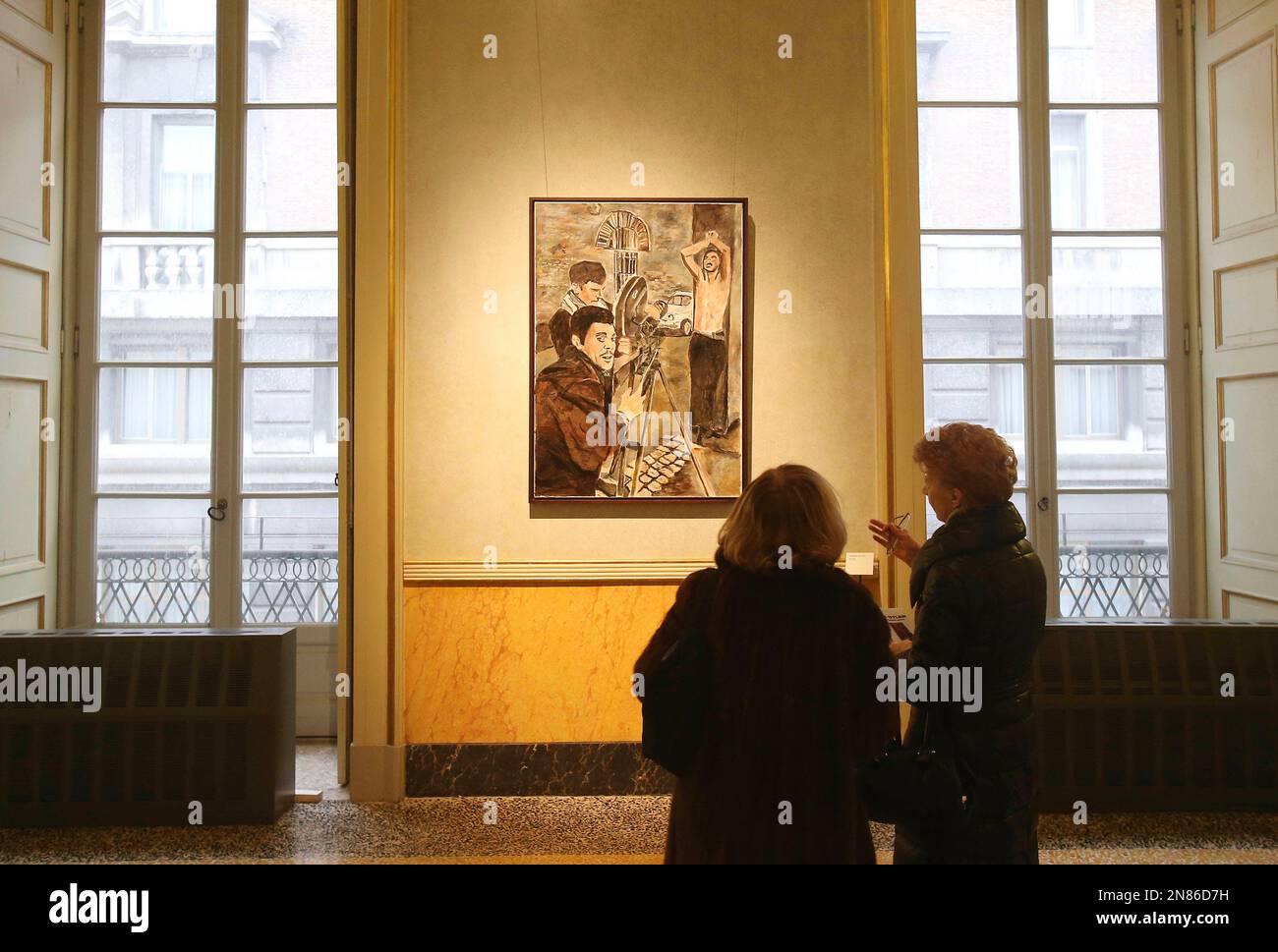 Visitors admire a painting by US singer Bob Dylan, part of his "New ...