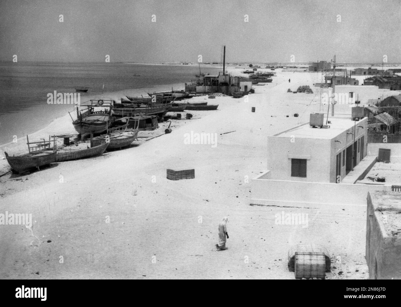 A view of the waterfront including a water distillation plant in Abu ...