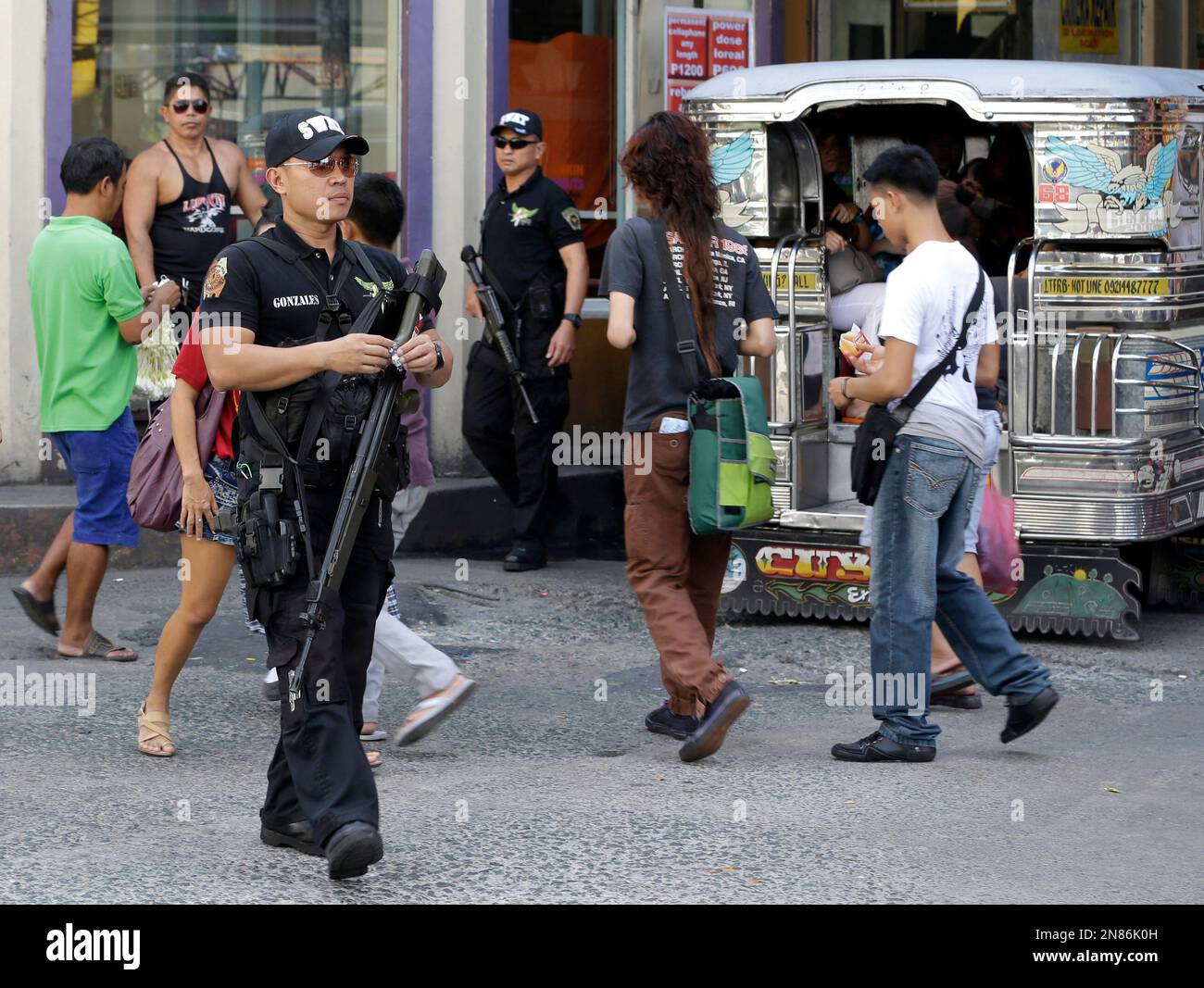 In this Friday Feb. 1, 2013 photo, Pasay city SWAT members of the ...