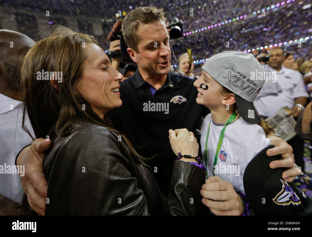 Baltimore Ravens head coach John Harbaugh hugs his wife Ingrid, left ...