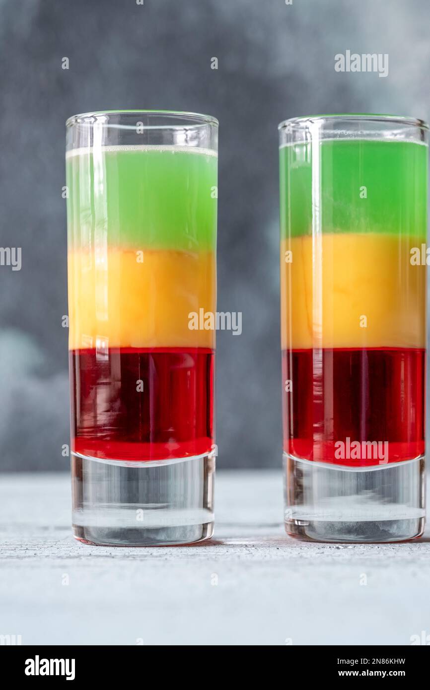 Layered Squashed Frog Cocktail in shot glass Stock Photo - Alamy