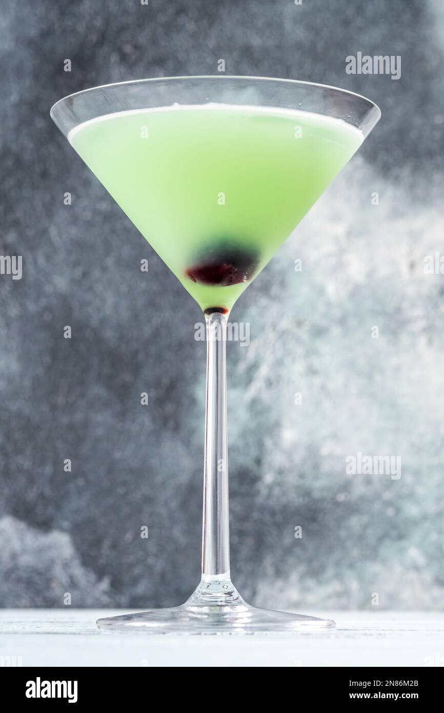 Japanese Slipper Cocktail in martini glass garnished with cherry Stock ...