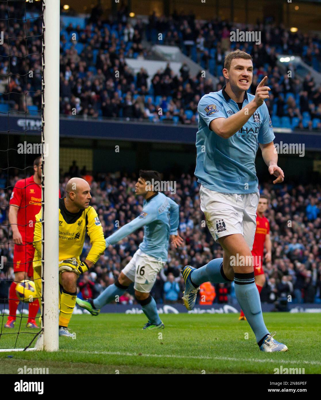 Manchester City's Edin Dzeko celebrates scoring against Liverpool ...