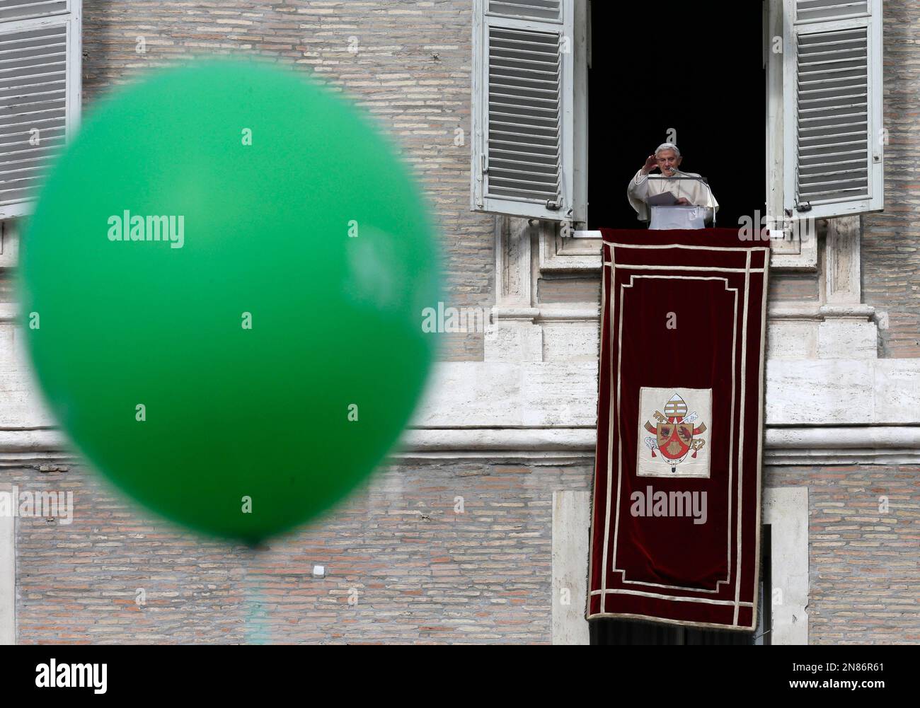 A balloon frames Pope Benedict XVI delivering his blessing during the ...