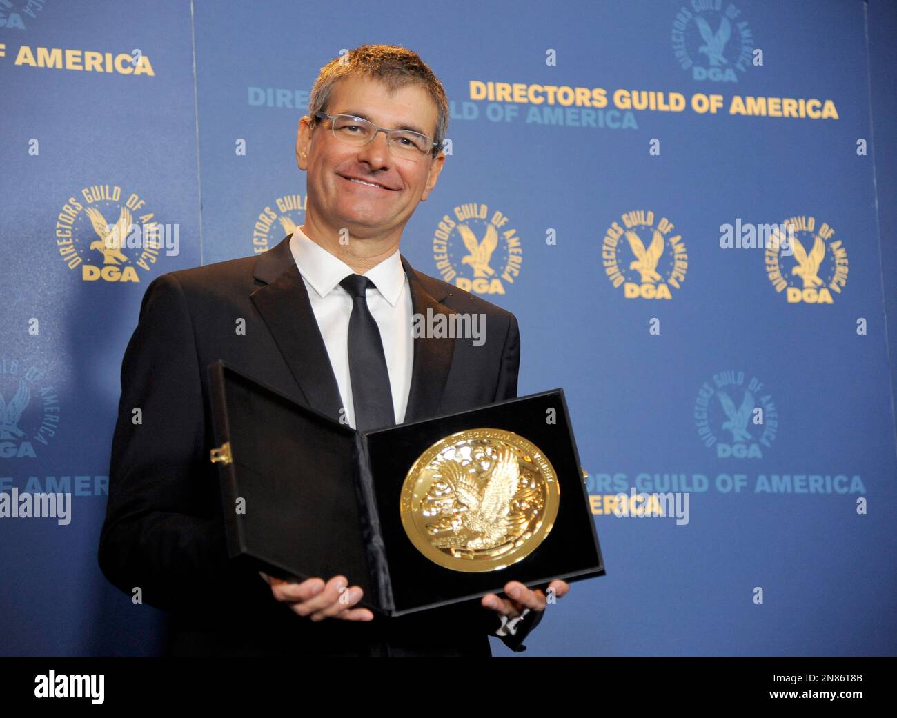 Paul Hoen poses backstage with his children's program award for "Let it ...