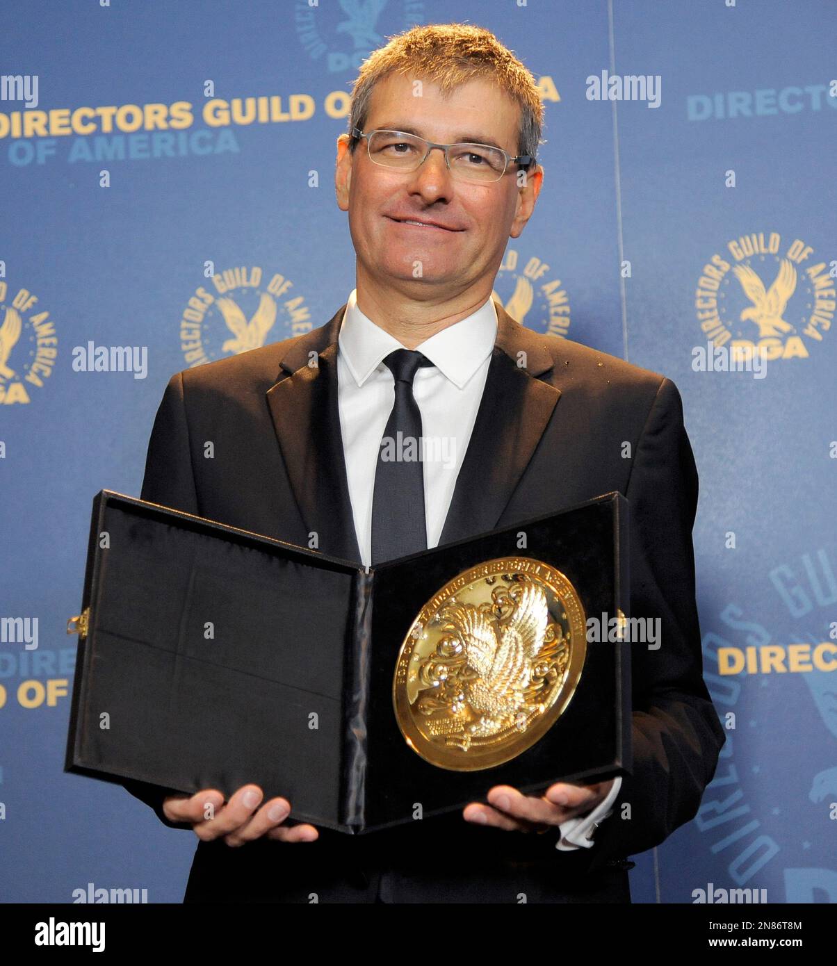 Paul Hoen poses backstage with his children's program award for "Let it ...
