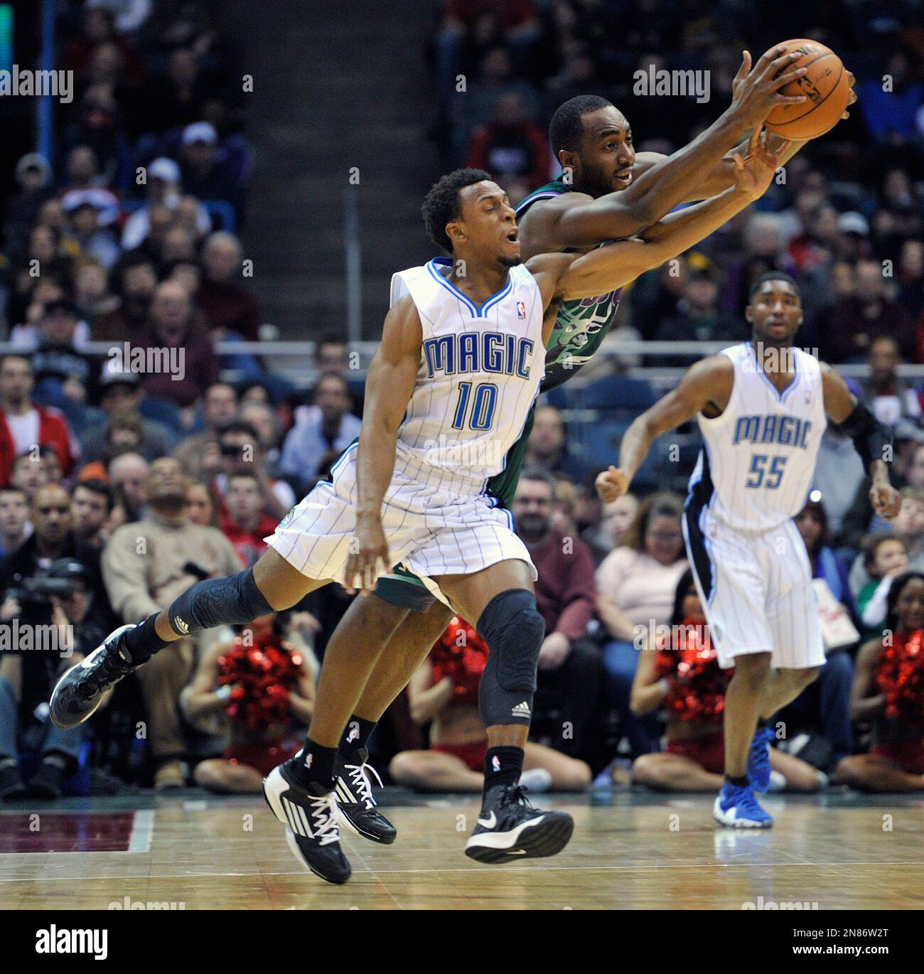 Orlando Magic's Ish Smith (10) and Milwaukee Bucks' Luc Richard Mbah a ...