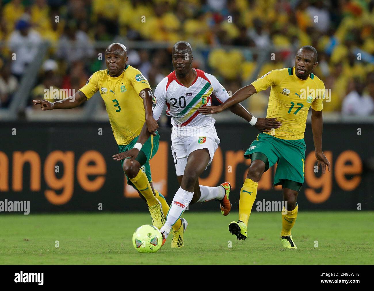 Mali's Samba Diakite, center, is challenged by South Africa's Tshepo ...