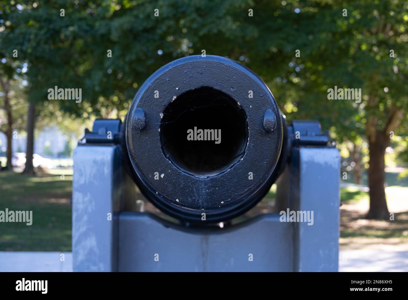 A closeup of old artillery, cannon placed in an open-air military ...