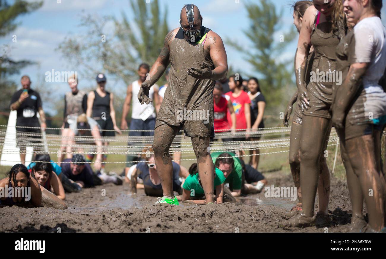 Kish Punaney stands up after crawling through the mud pit during the 5k ...