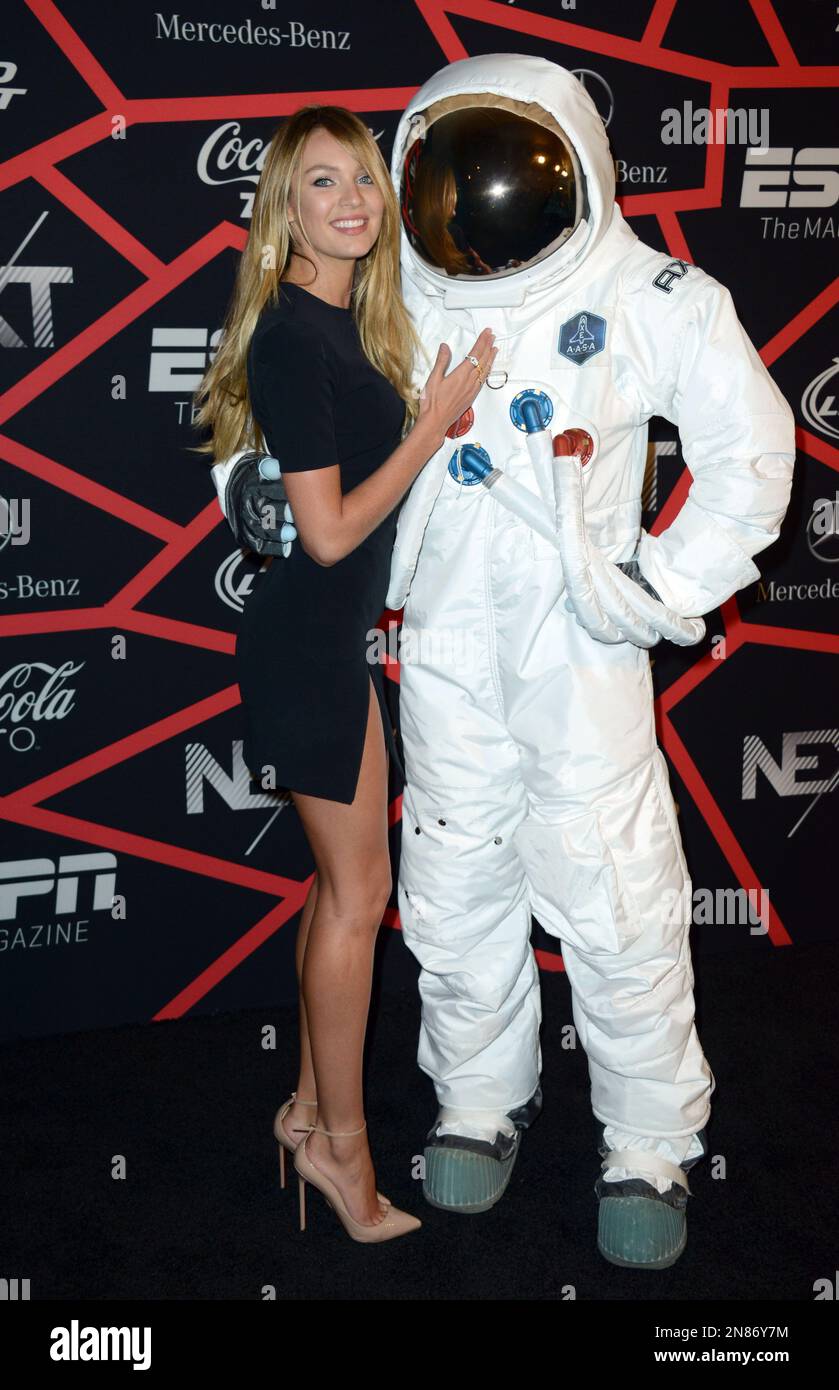 Model Candice Swanepoel, left, and an AXE astronaut arrive at ESPN The Magazine's "Next" Event ...