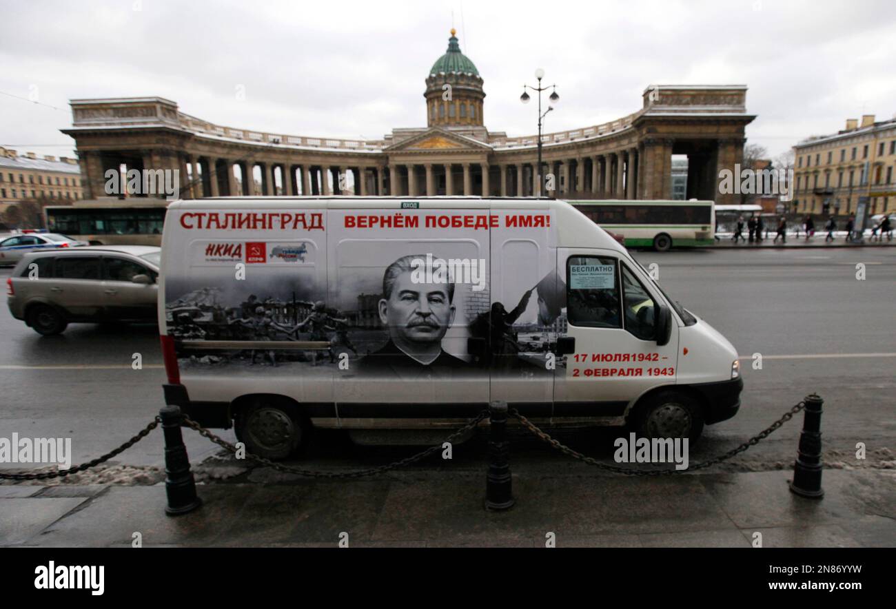 A bus decorated with a portrait of Soviet dictator Josef Stalin and a ...