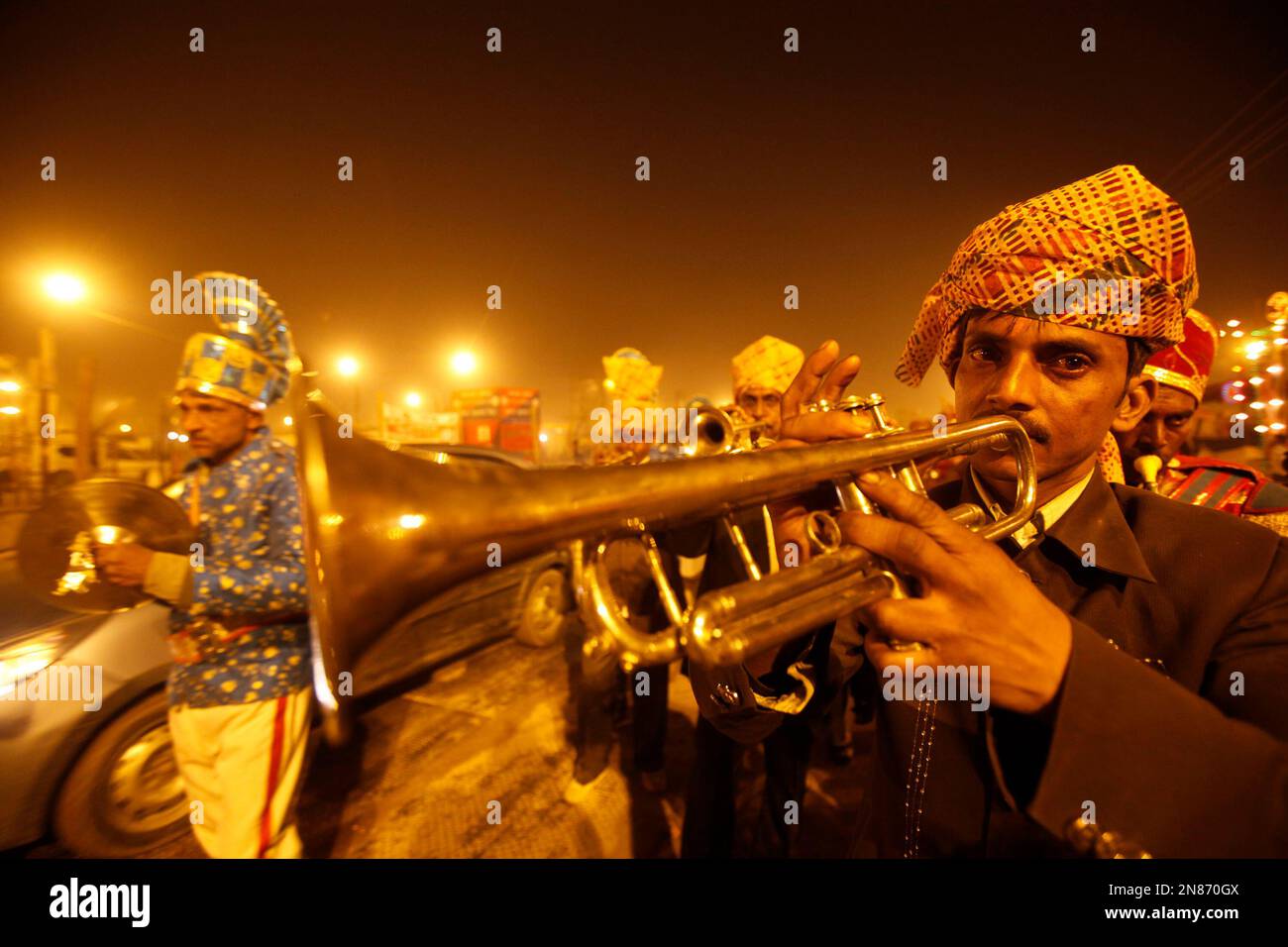 In this late Friday, Feb. 1, 2013 photo, an Indian brass band ...