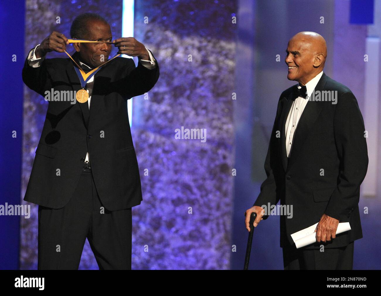 Sidney Poitier, left, presents the Spingarn award to Harry Belafonte at ...