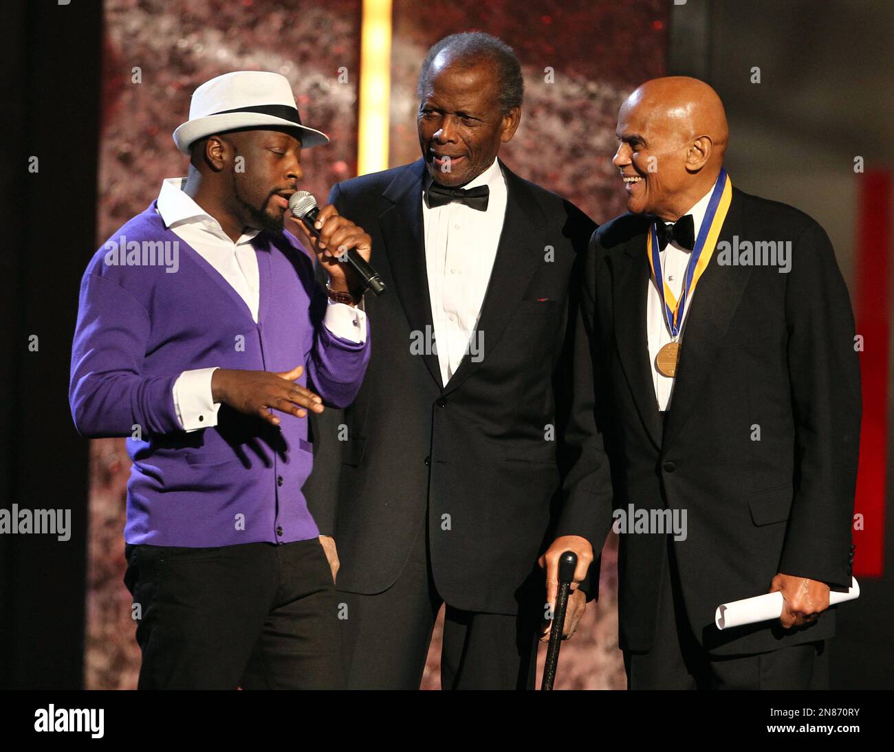 From left, Wyclef Jean and Sidney Poitier present the Spingarn award to ...