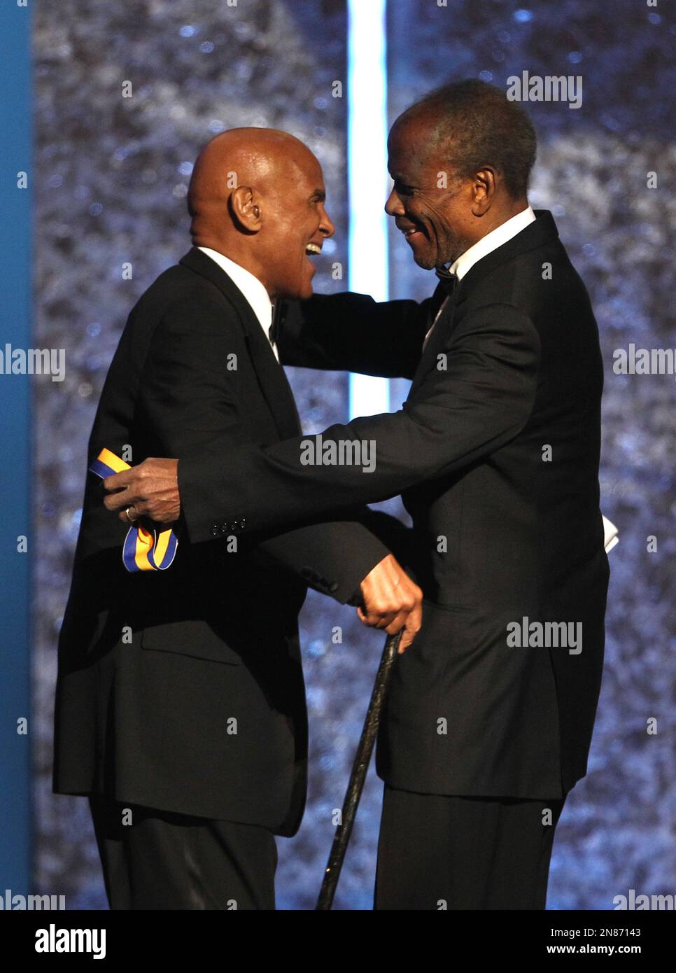 Sidney Poitier, left, presents the Spingarn award to Harry Belafonte at ...