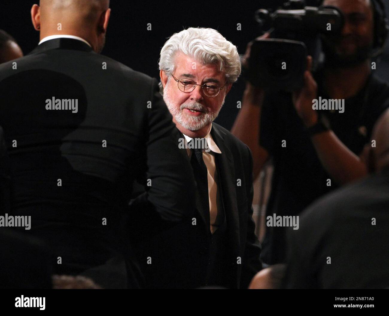 George Lucas walks onstage to accept the award for outstanding motion ...