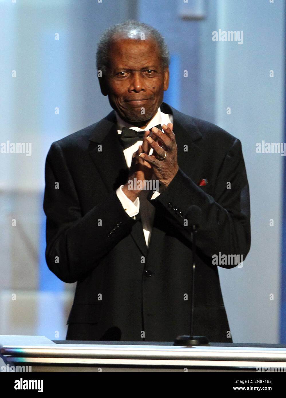 Sidney Poitier presents the Spingarn award to Harry Belafonte at the ...