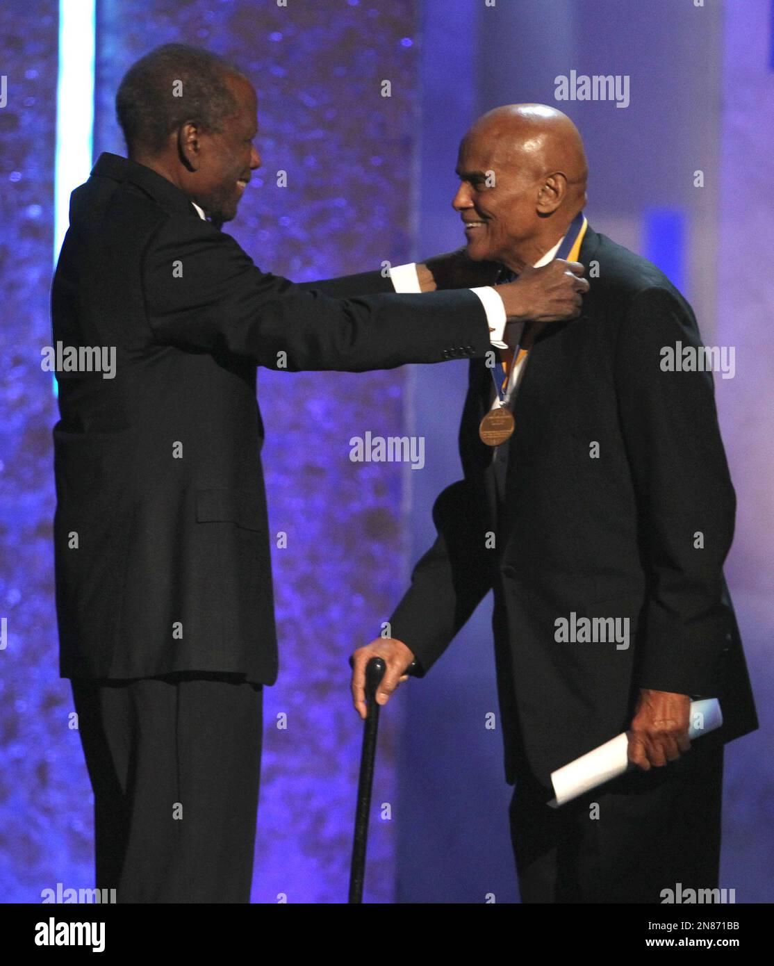 Sidney Poitier, left, presents the Spingarn award to Harry Belafonte at ...