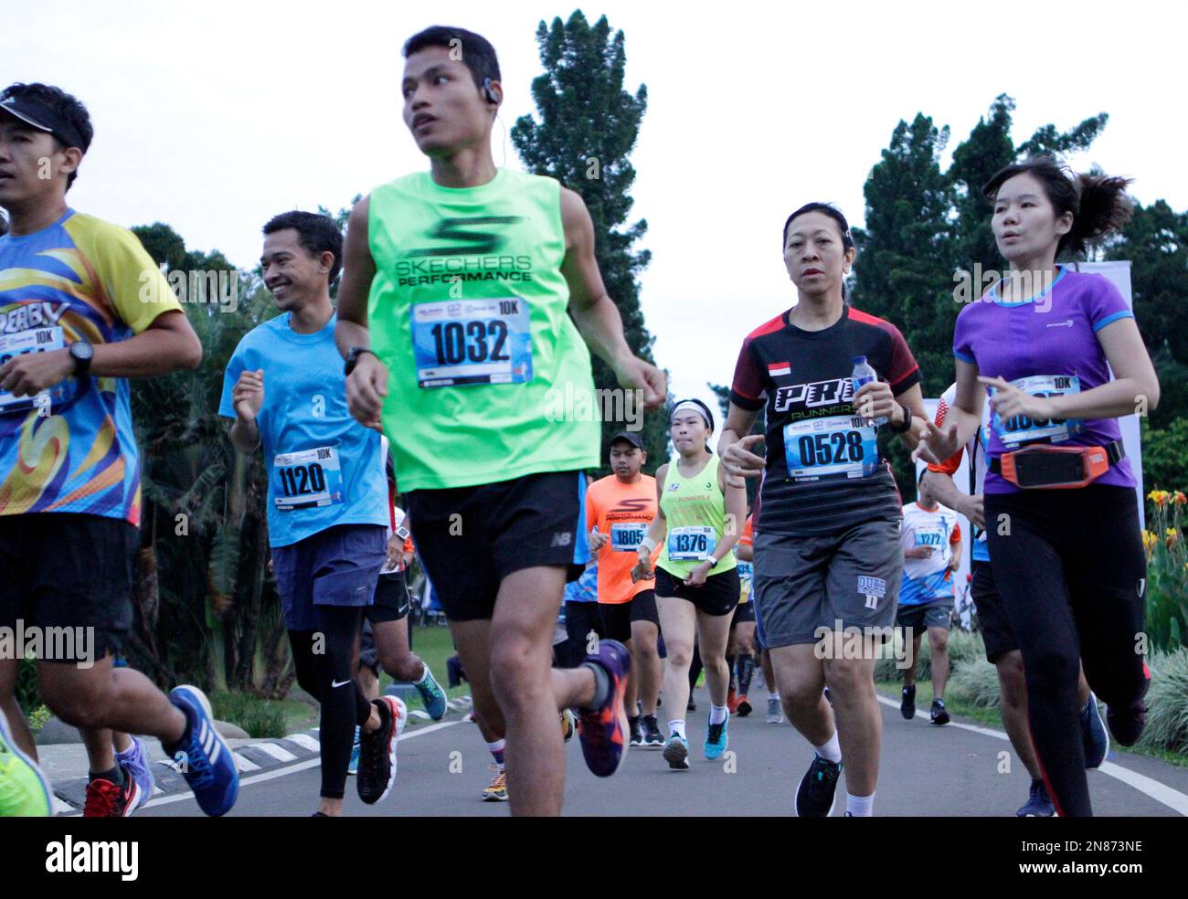 a marathon running event which is attended by many participants, both ...