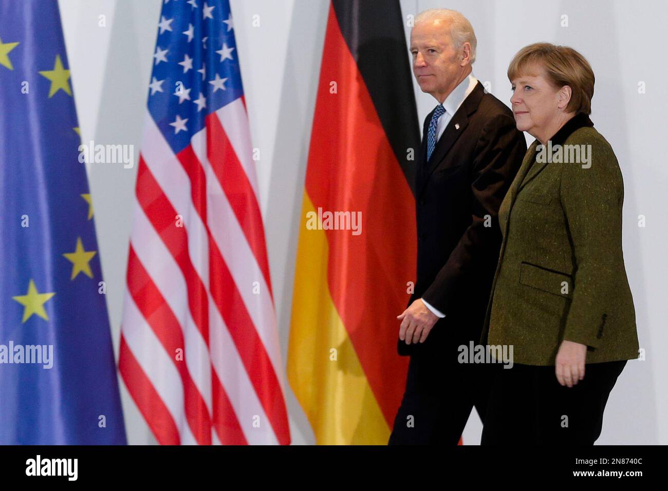 German Chancellor Angela Merkel, right, walks with United States' Vice ...