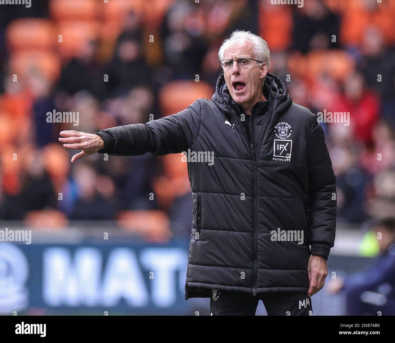 Mick McCarthy manager of Blackpool gives his team instructions during ...