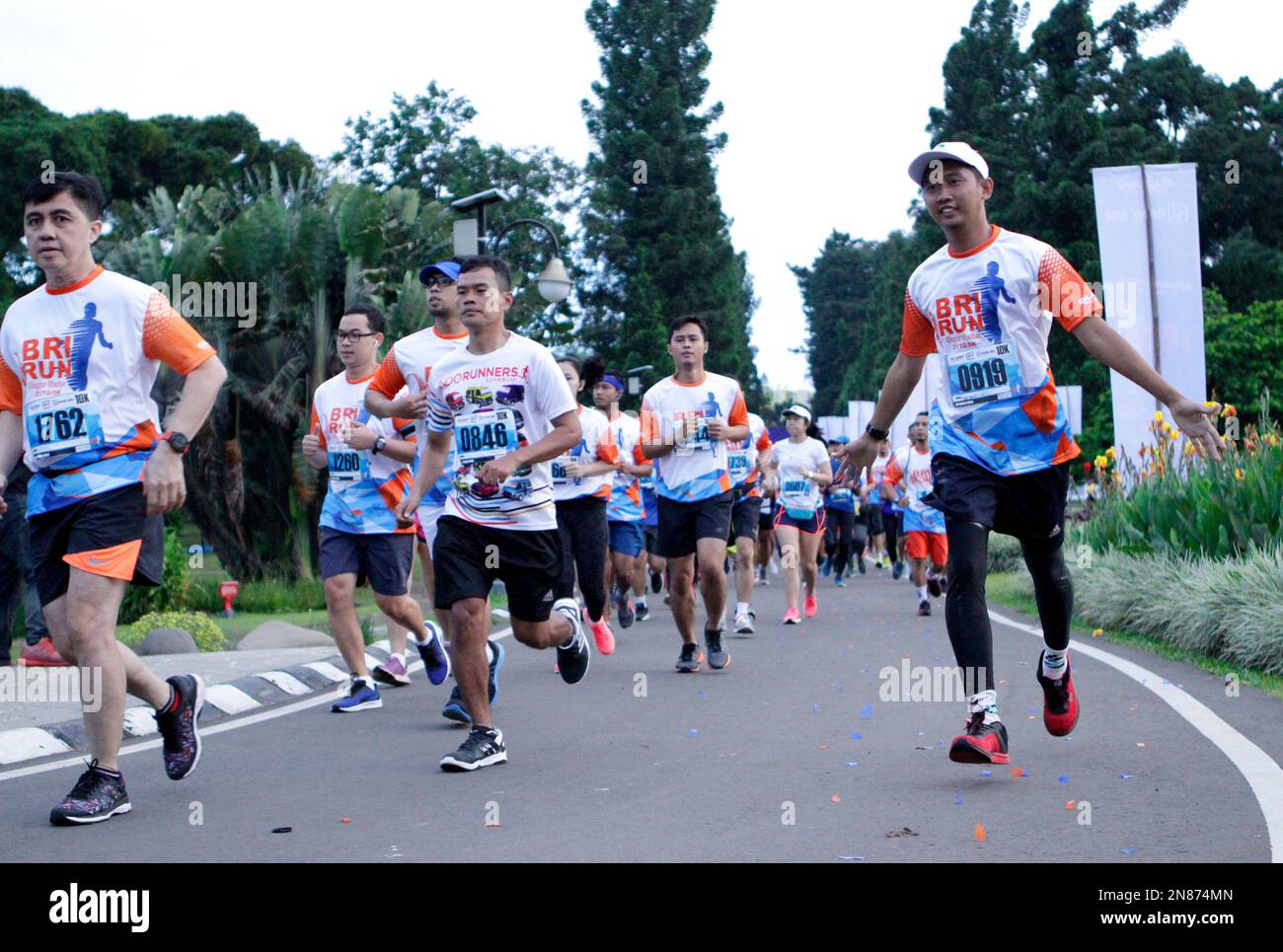 a marathon running event which is attended by many participants, both ...