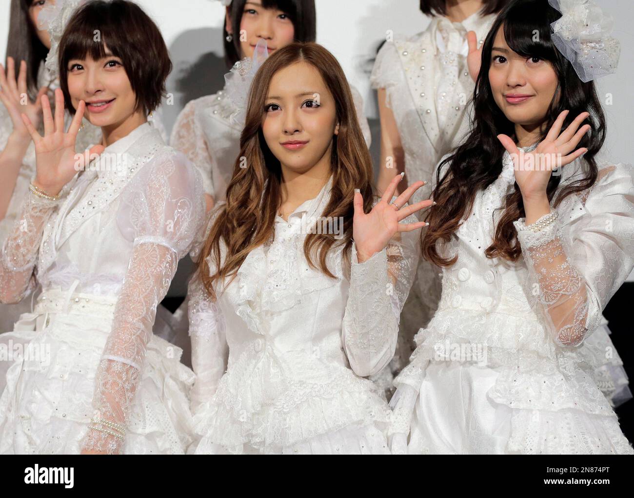 Members of Japanese girls pop gourp AKB48, from left, Mariko Shinoda ...
