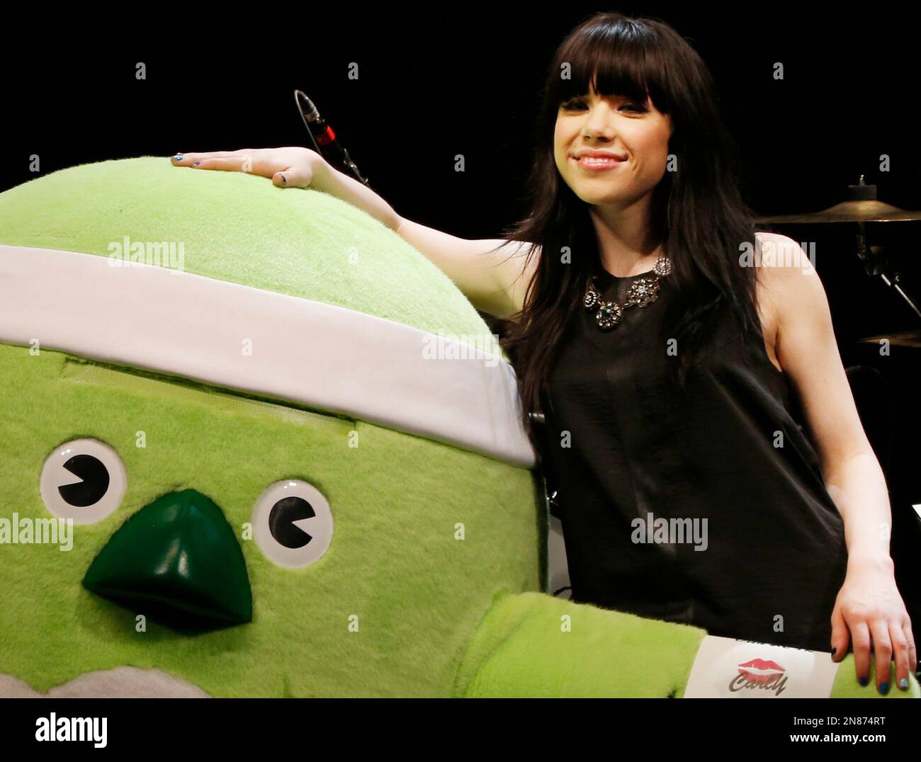 Canadian singer Carly Rae Jepsen smiles during a photo session with one ...