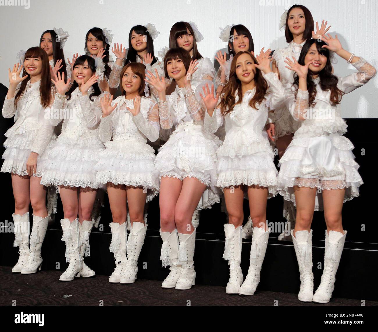 Members of Japanese girls pop gourp AKB48, from left in first row ...