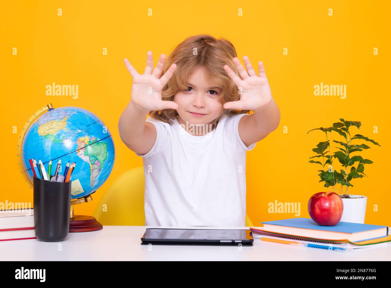 Stop bullying. Sad and angry pupil. Nerd school kid isolated on studio background. Clever child ...