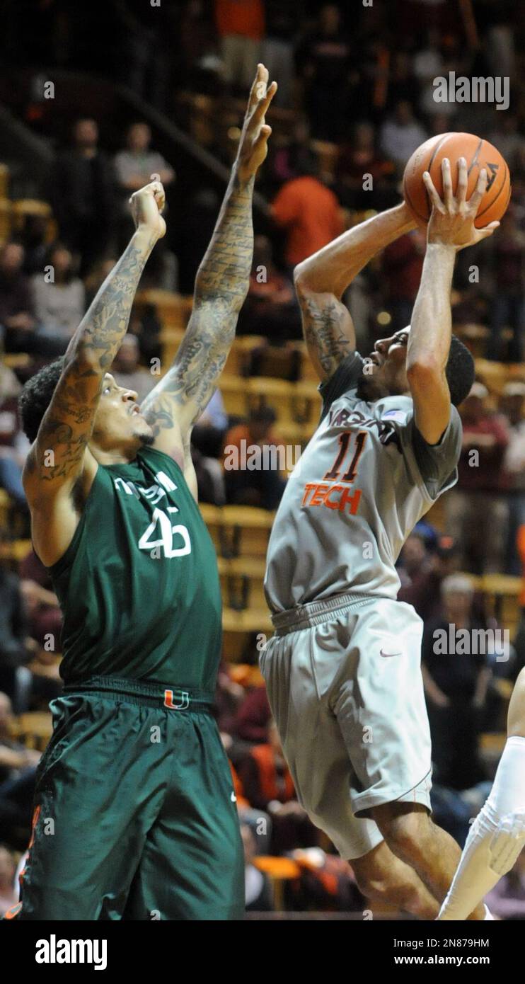 Virginia Tech's Erick Green shoots over Miami's Julian Gamble during ...