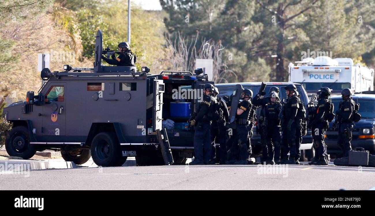 Members of the Phoenix Police Department SWAT team prepare to enter the ...