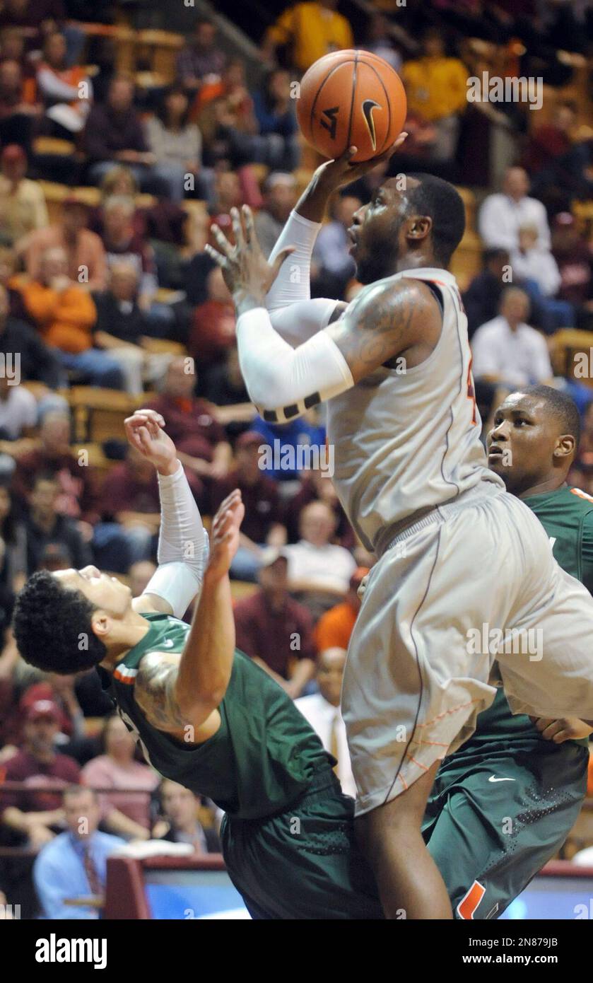 Virginia Tech's Cadarian Raines drives to the basket against Miami's ...