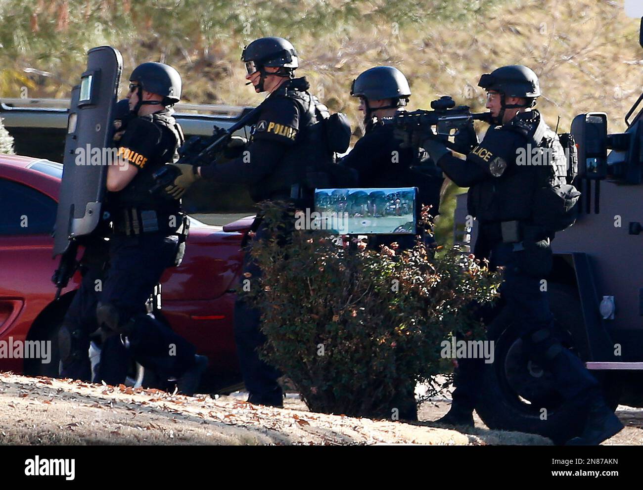 Members of the Phoenix Police Department SWAT team prepare to enter the ...