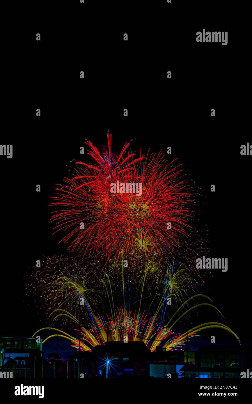 A vertical shot of beautiful colorful fireworks in Daisen City. Akita ...