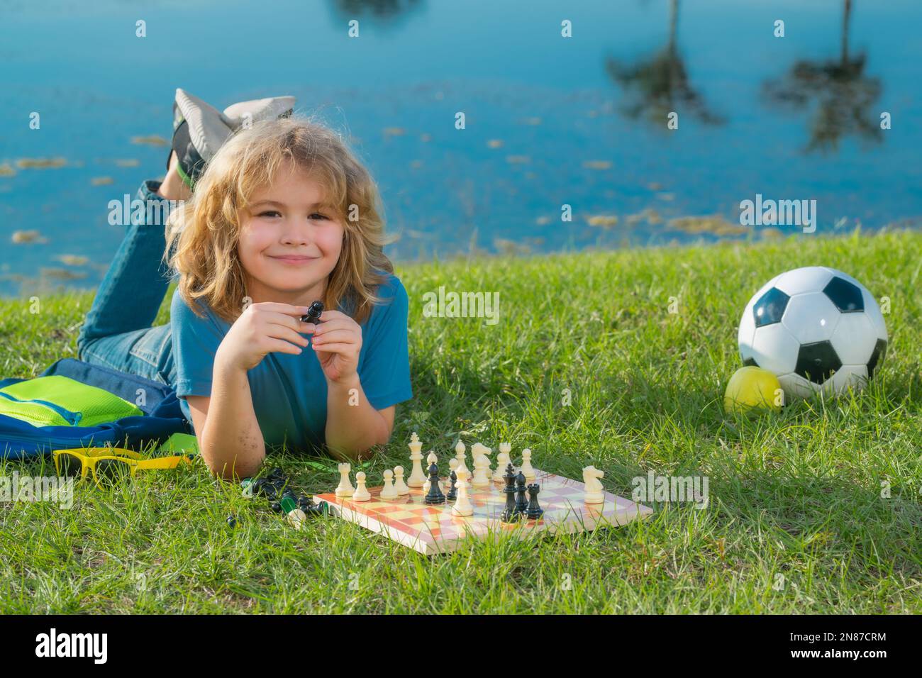 Dream kids and childhood concept. Chess game for children. Kid playing ...